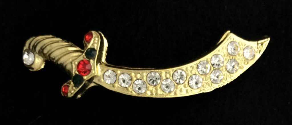 Shrine Scimitar Tassel Holder in Gold With Colored Stones